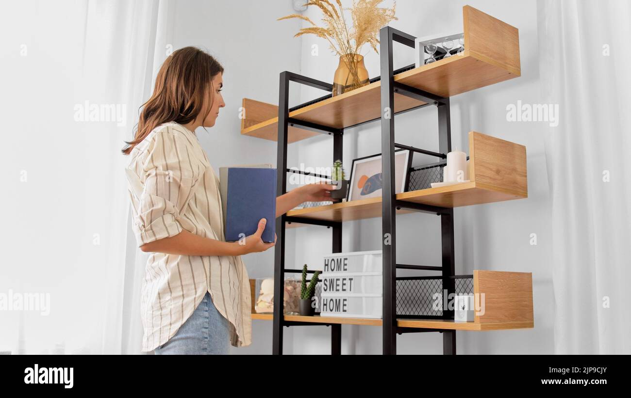 Woman arranging at home hi-res stock photography and images - Alamy