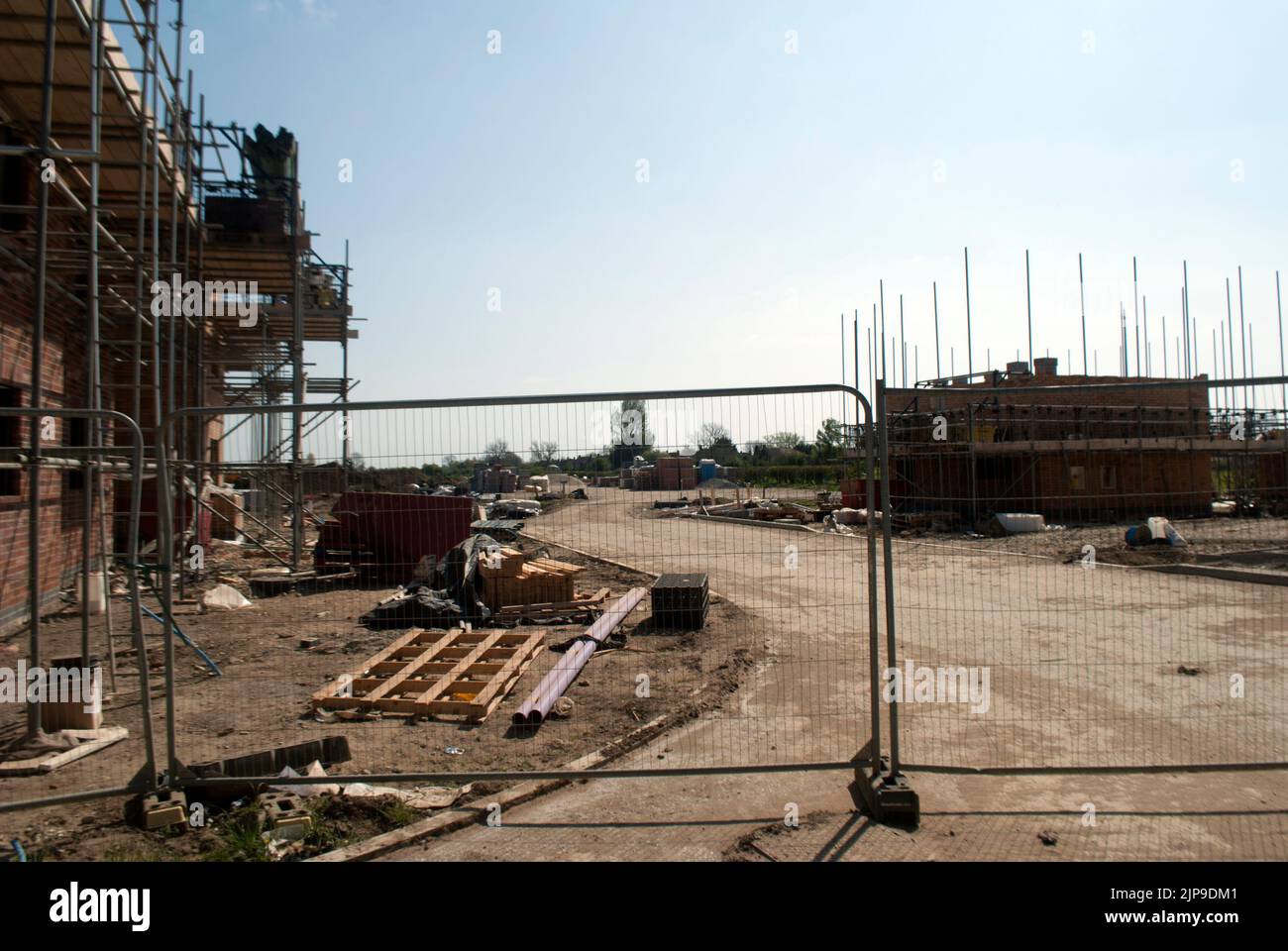 Partially constructed housed surrounded by scaffolding on a building ...