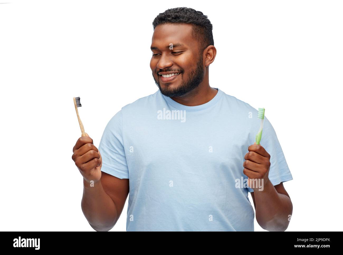 african man with wooden and plastic toothbrushes Stock Photo - Alamy