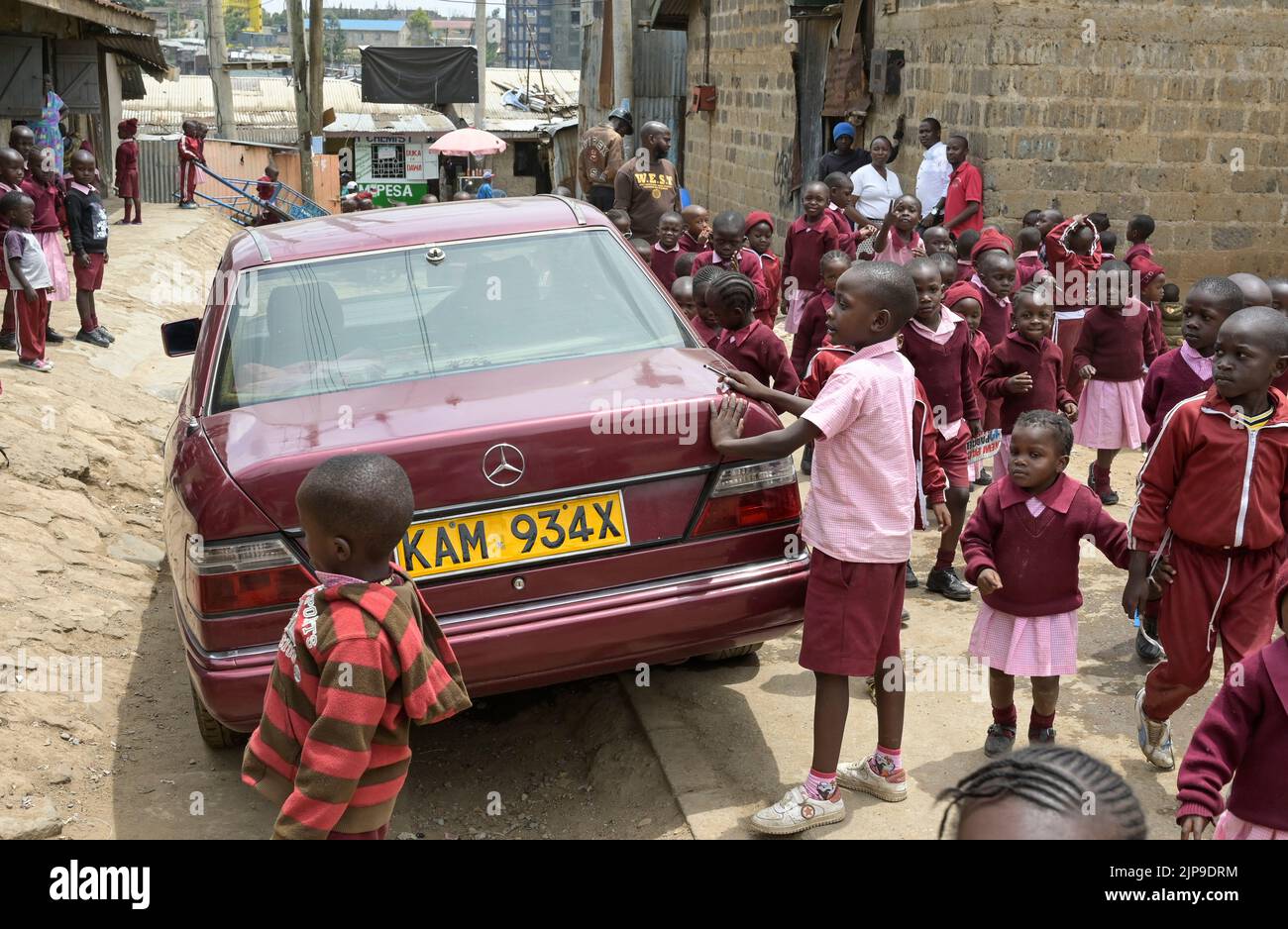 KENYA, Nairobi, Mathare Slum, contrast school children and used ...