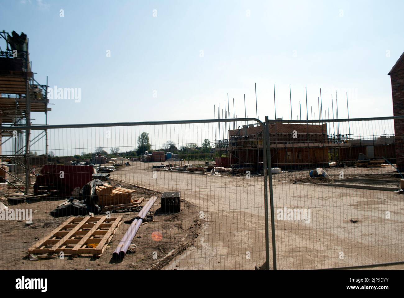 Partially constructed housed surrounded by scaffolding on a building ...