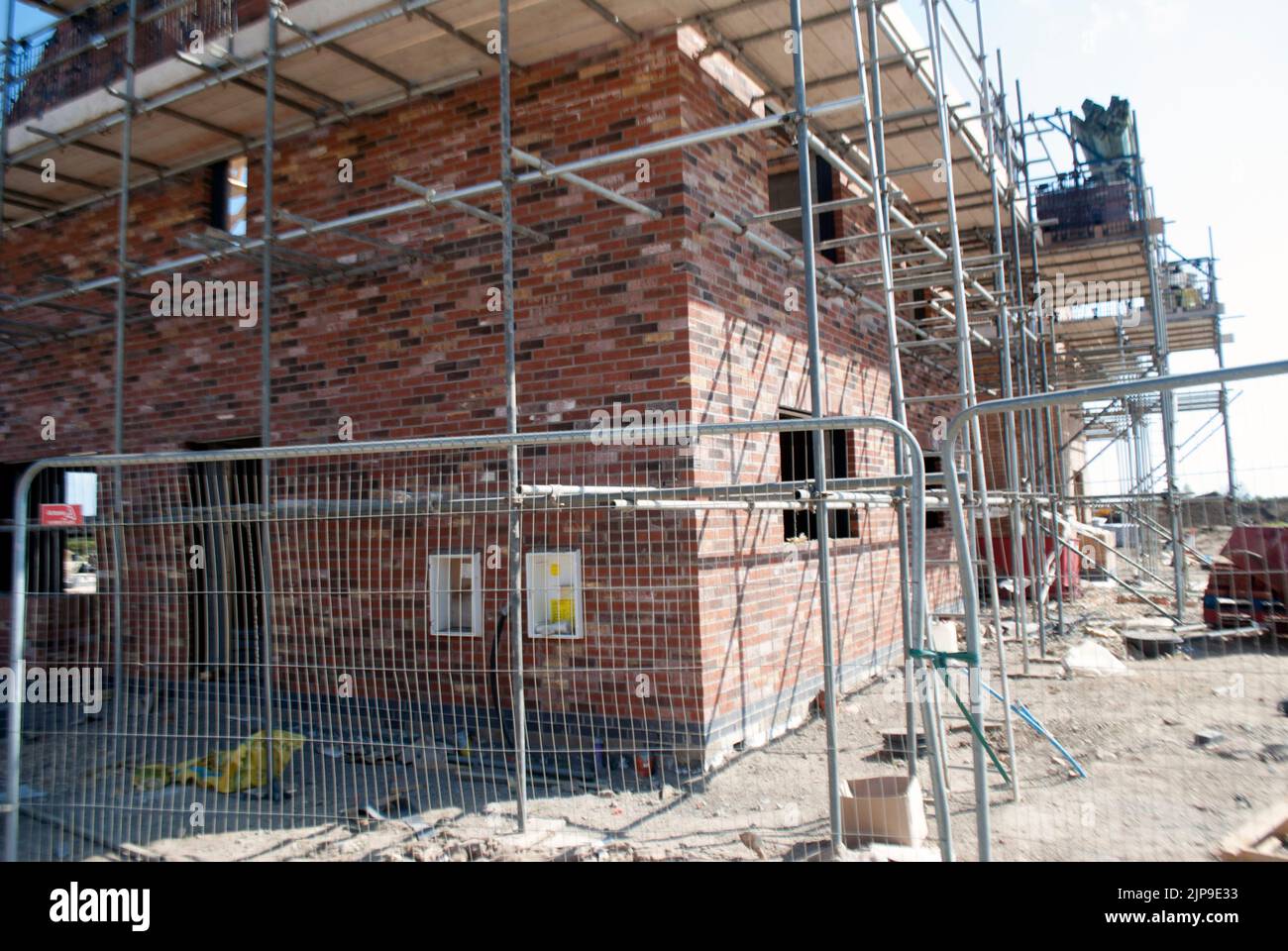 Partially constructed housed surrounded by scaffolding on a building ...