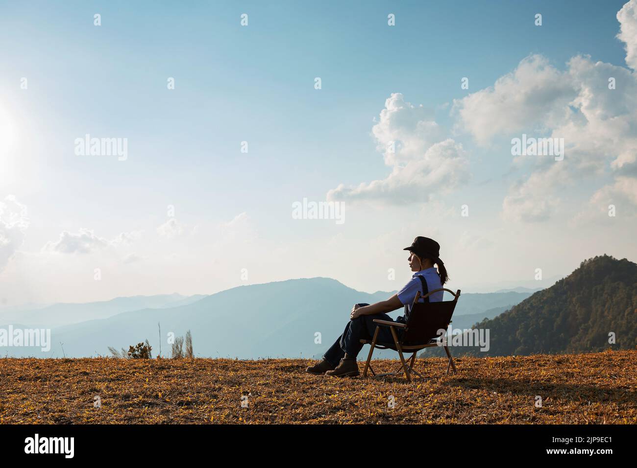 asian female in cowboy fashion style relax her vacation with cows ...