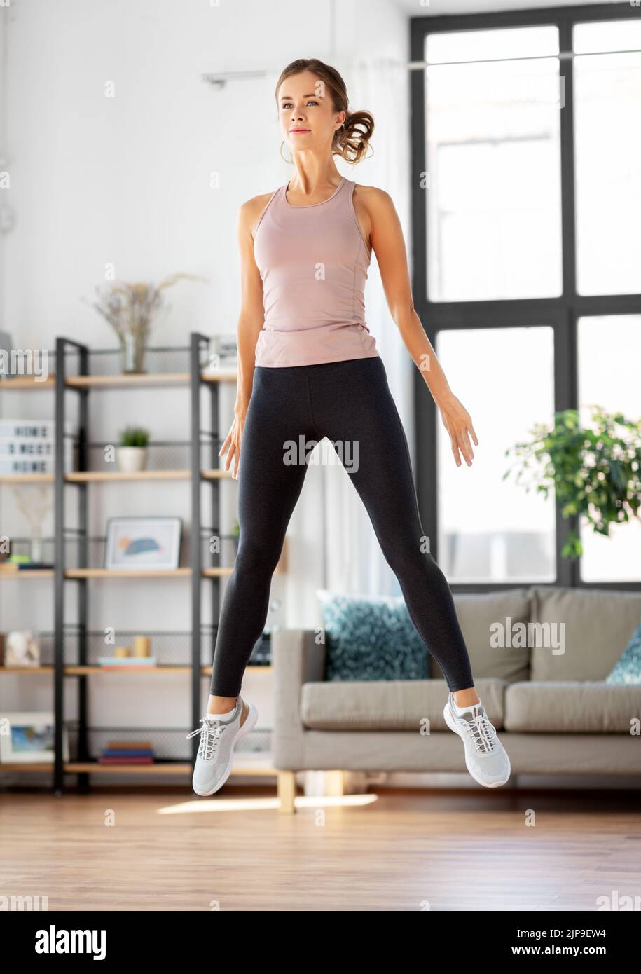 young woman exercising at home Stock Photo - Alamy