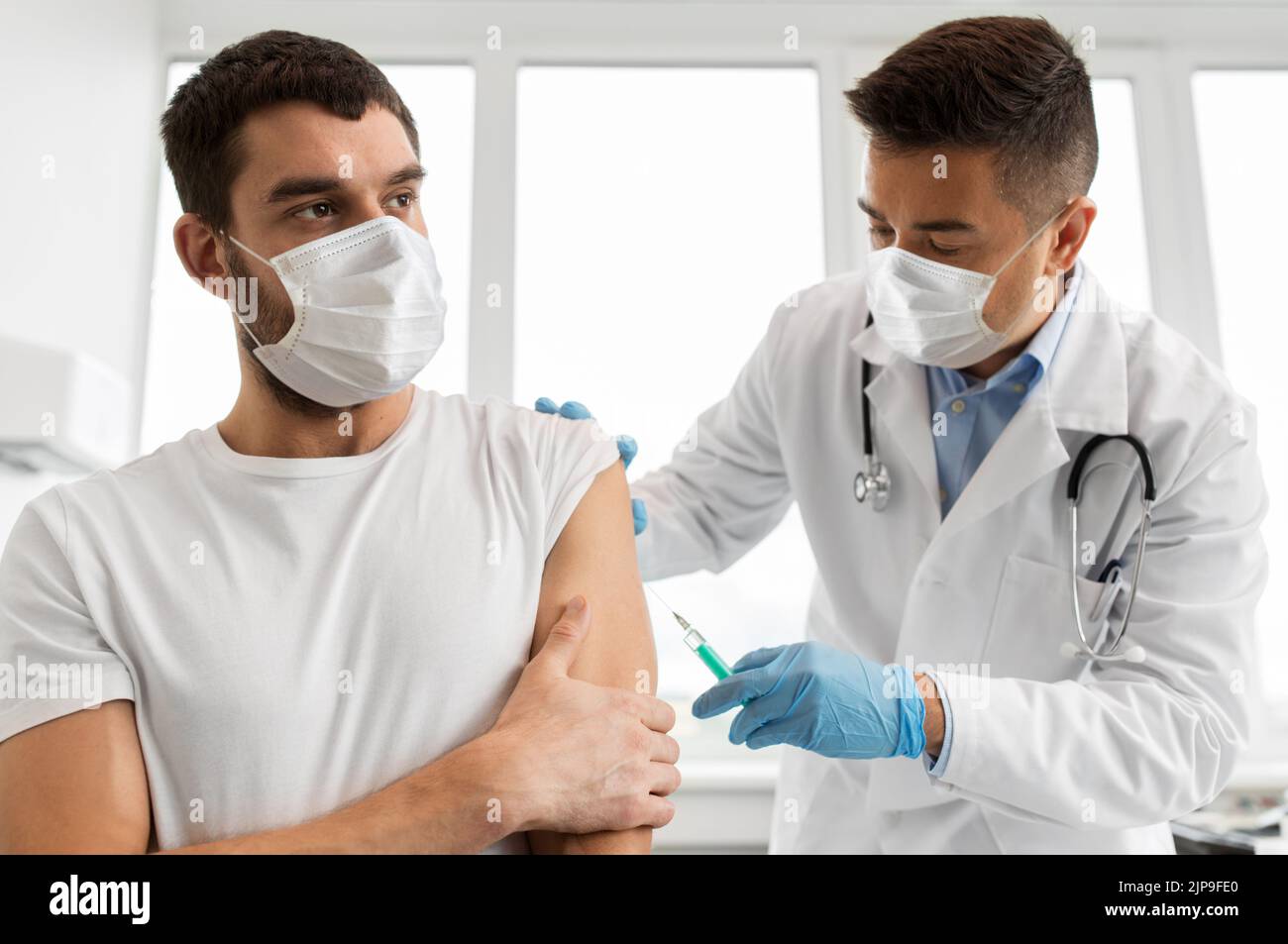 Doctor patient in protective masks hi-res stock photography and images ...