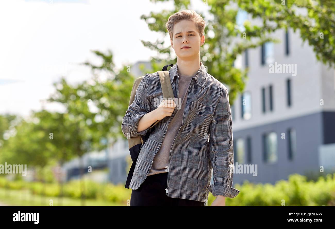 teenage student boy with backpack in city Stock Photo - Alamy