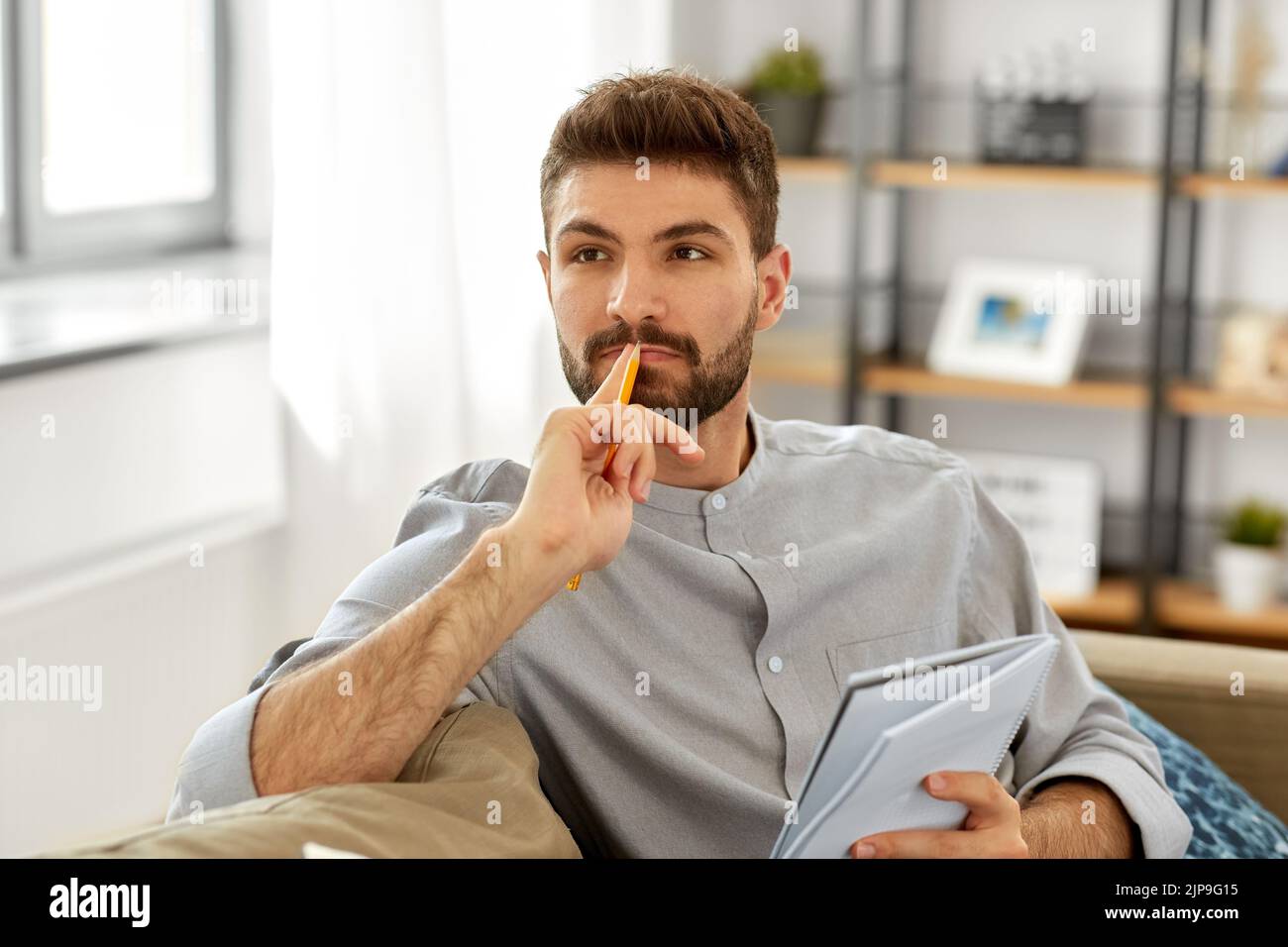 Beard young man thinking writing hi-res stock photography and images ...