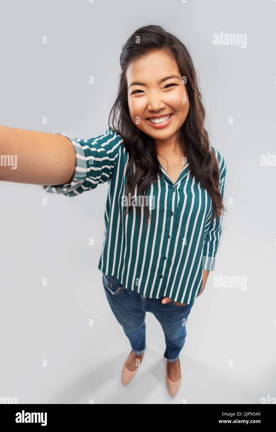 happy smiling asian woman taking selfie Stock Photo - Alamy