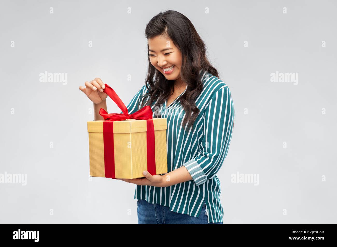 happy asian woman opening gift box Stock Photo - Alamy
