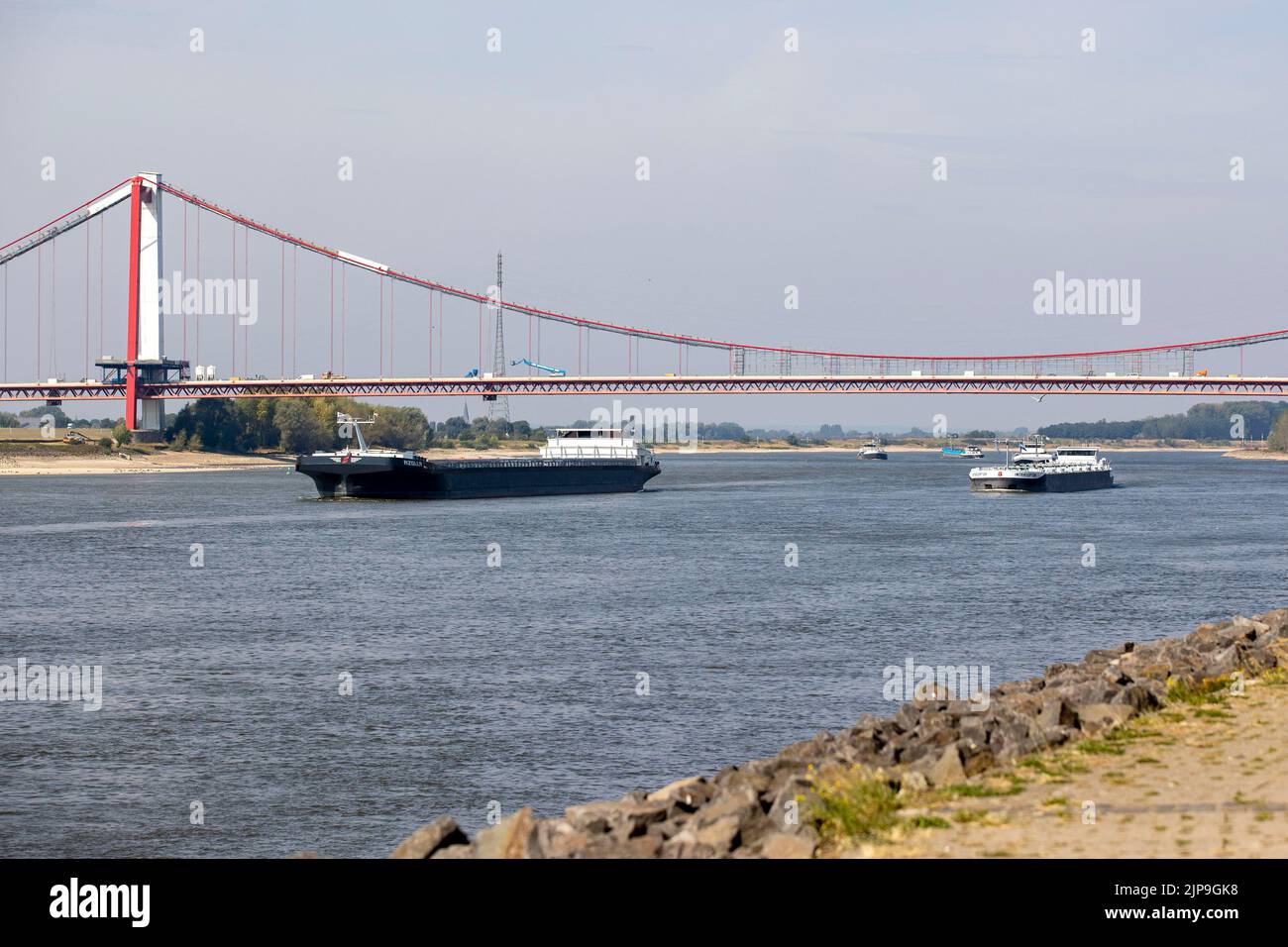 Emmerich, Germany. 16th Aug, 2022. Cargo ships and tankers are on the ...