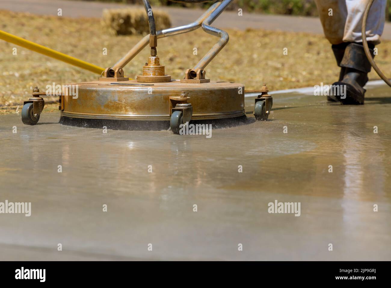 An employee used sweeper machines to wash the pavement as part of the ...