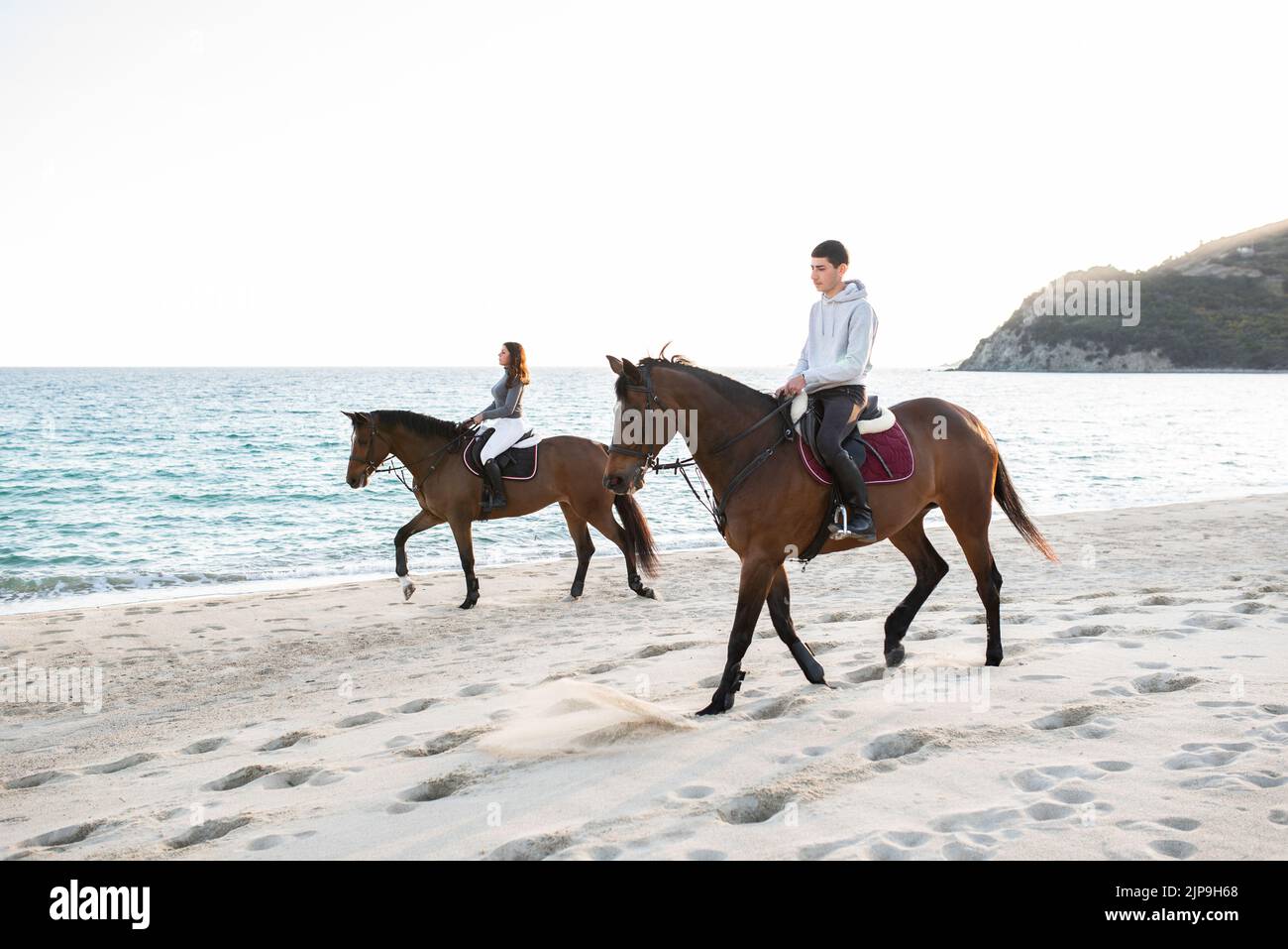 Woman rides horse beach hi-res stock photography and images - Alamy