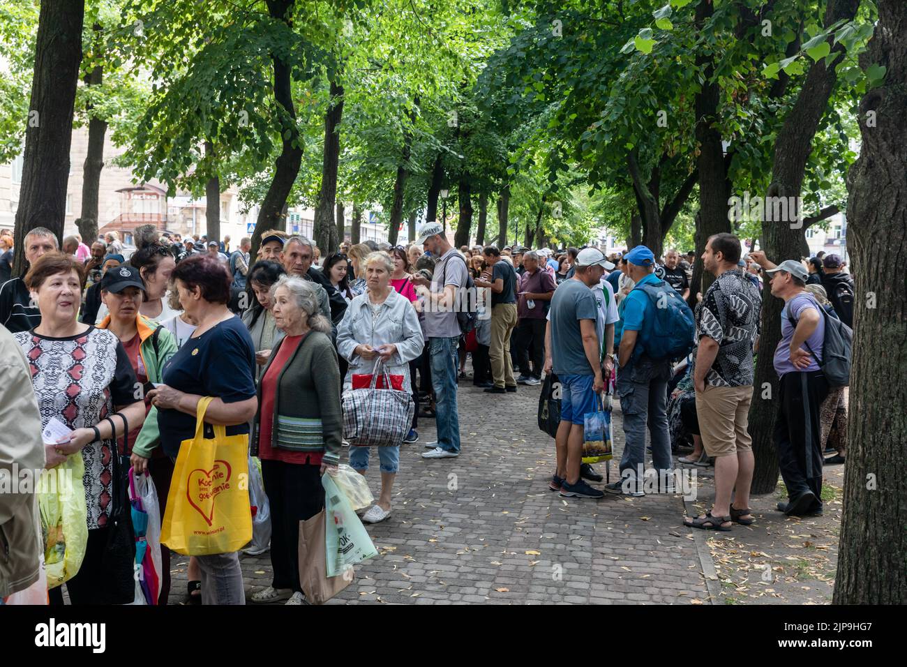 A queue of people in need of humanitarian assistance. Caritas of ...