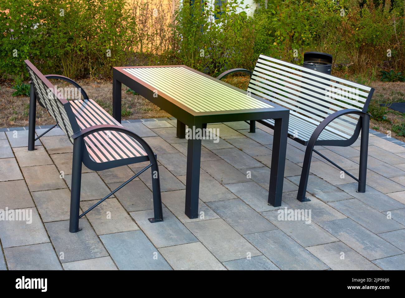 set of table and two modern style benches outdoors Stock Photo - Alamy