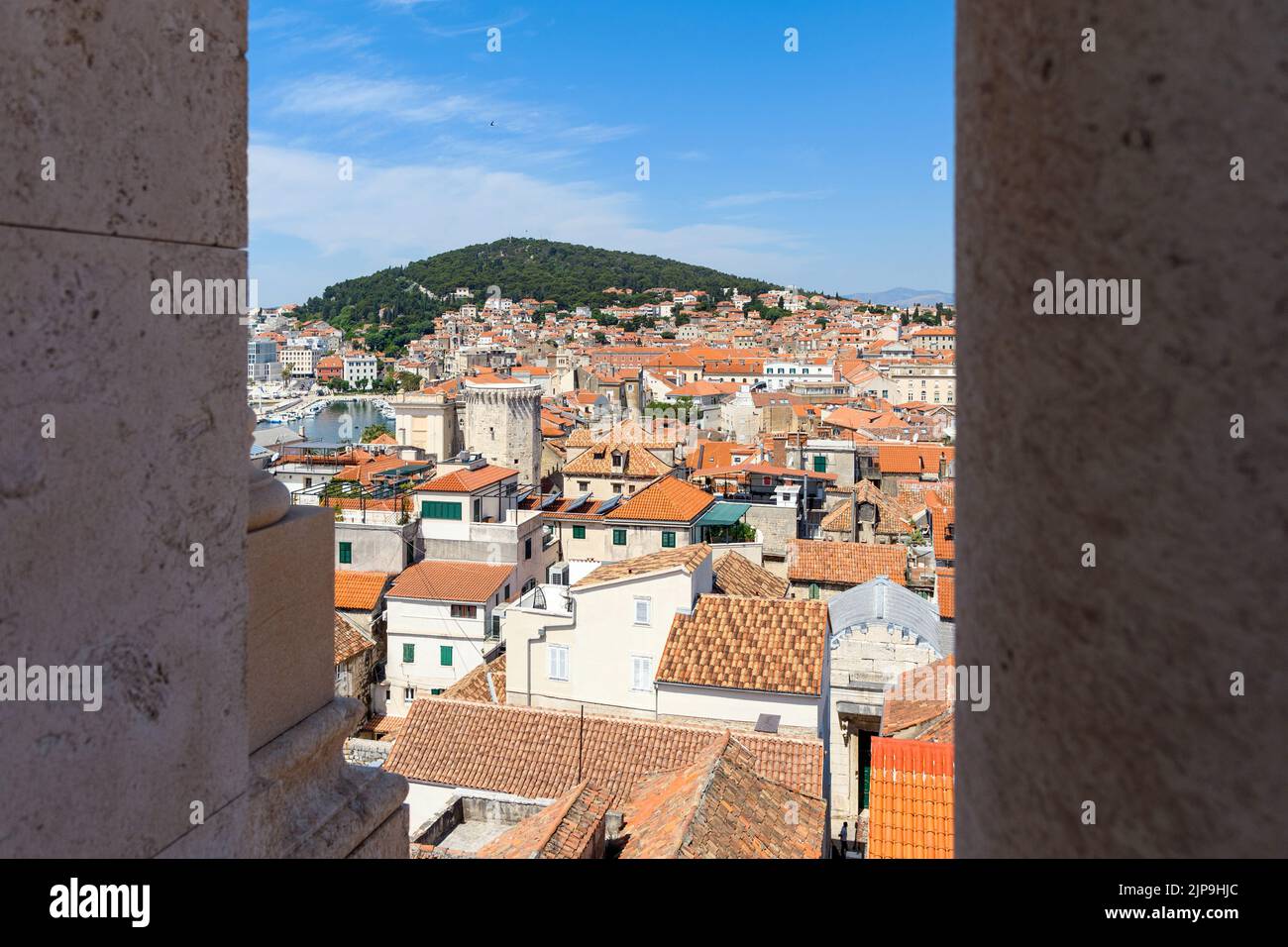 The cityscape of Split with red-roofed buildings, captured through the ...