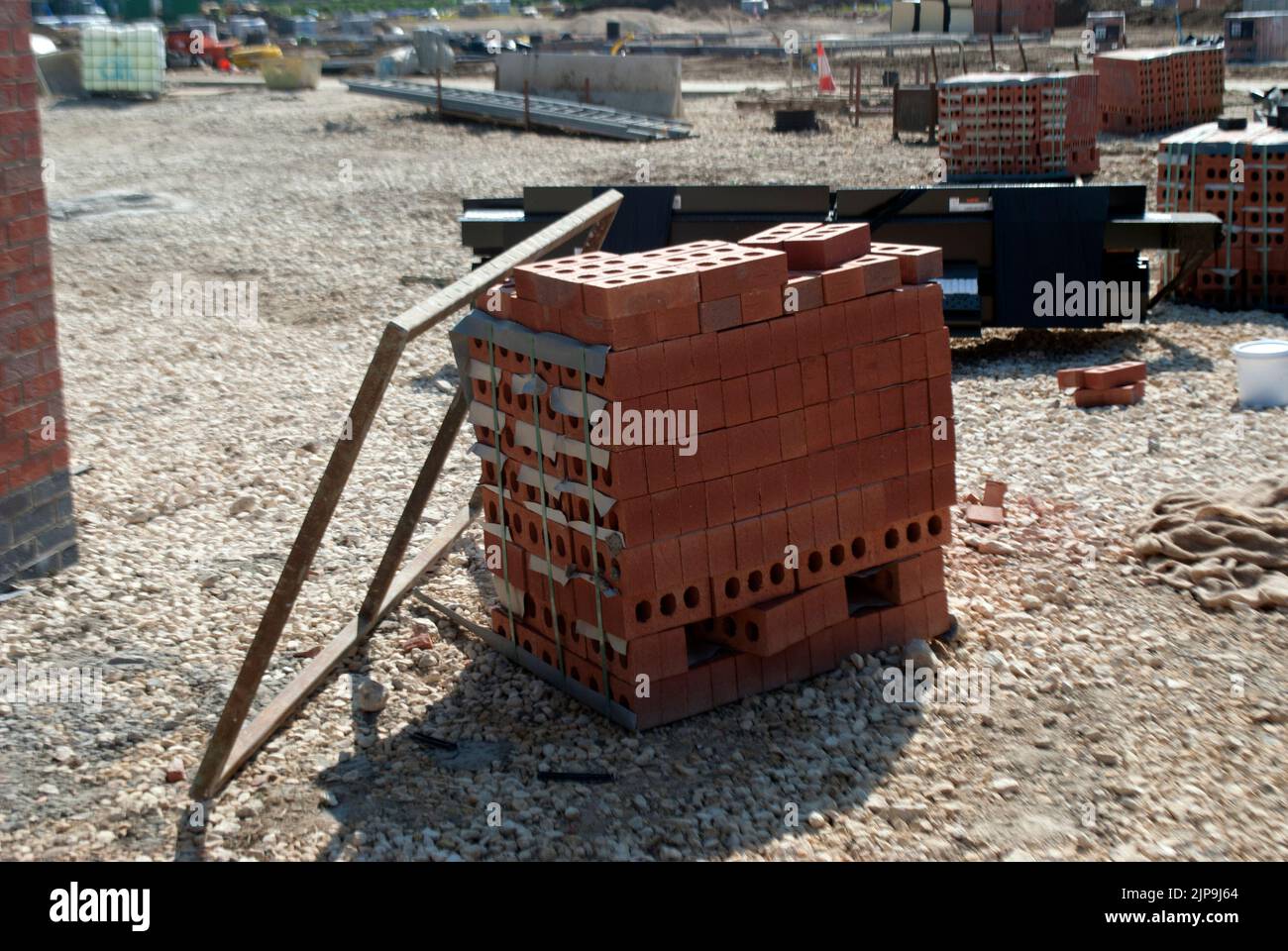 Stacked pallets of building materials on a building site Stock Photo ...