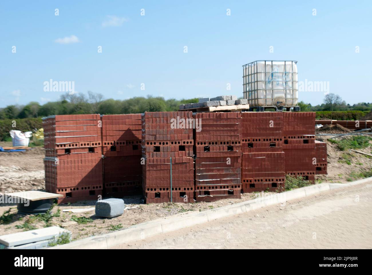 Stacked pallets of building materials on a building site Stock Photo ...