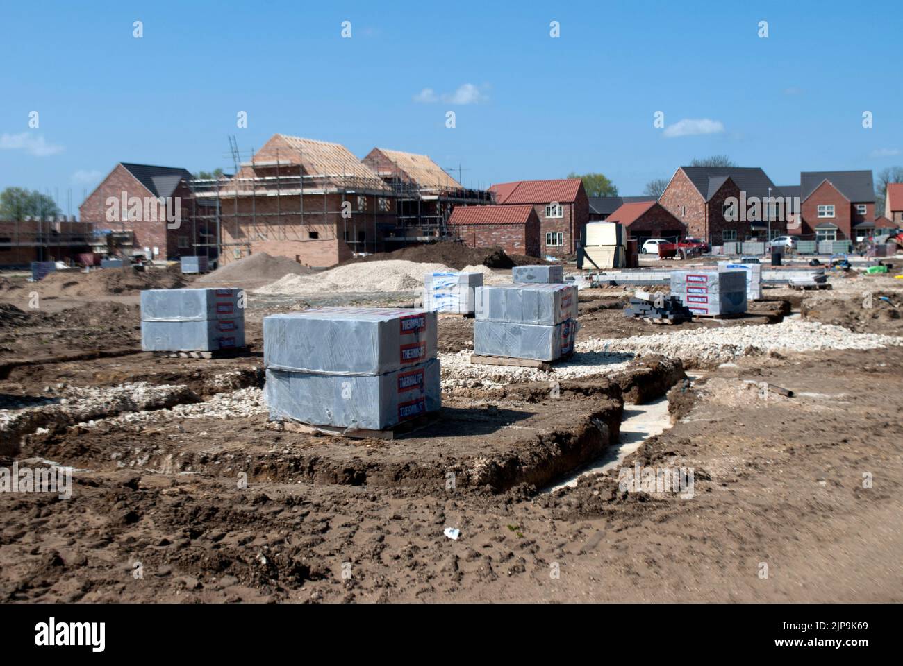 Stacked pallets of building materials on a building site Stock Photo ...