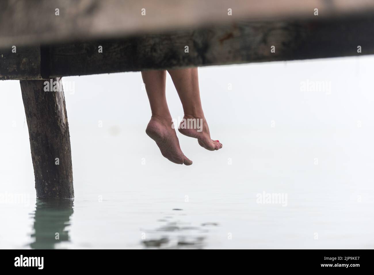 Lady feet dangling hi-res stock photography and images - Alamy
