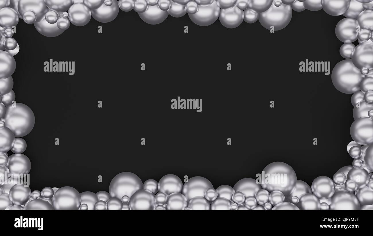 Silver colored metallic balls border on frame with black background ...