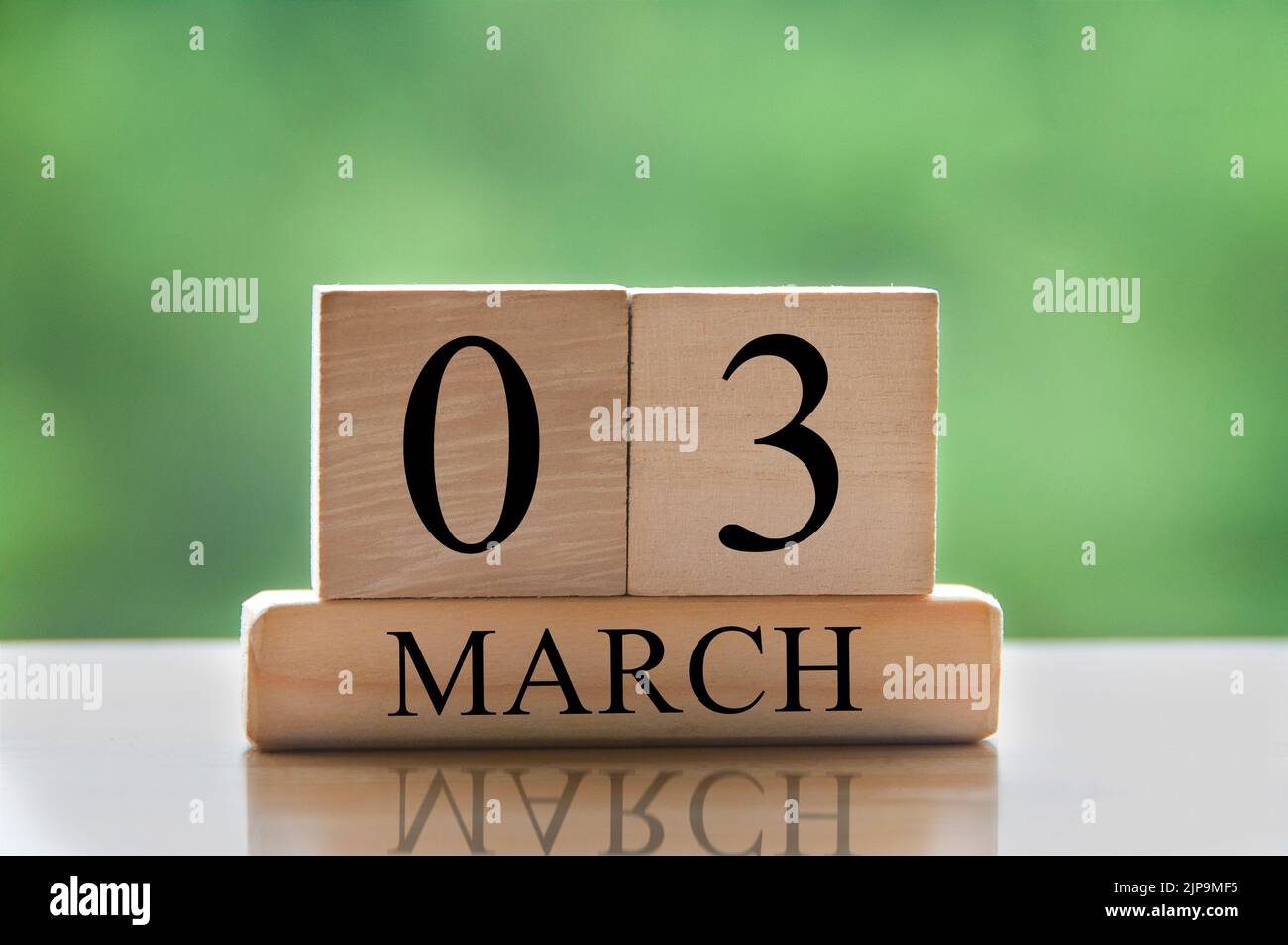 March 3 calendar date text on wooden blocks with blurred park ...