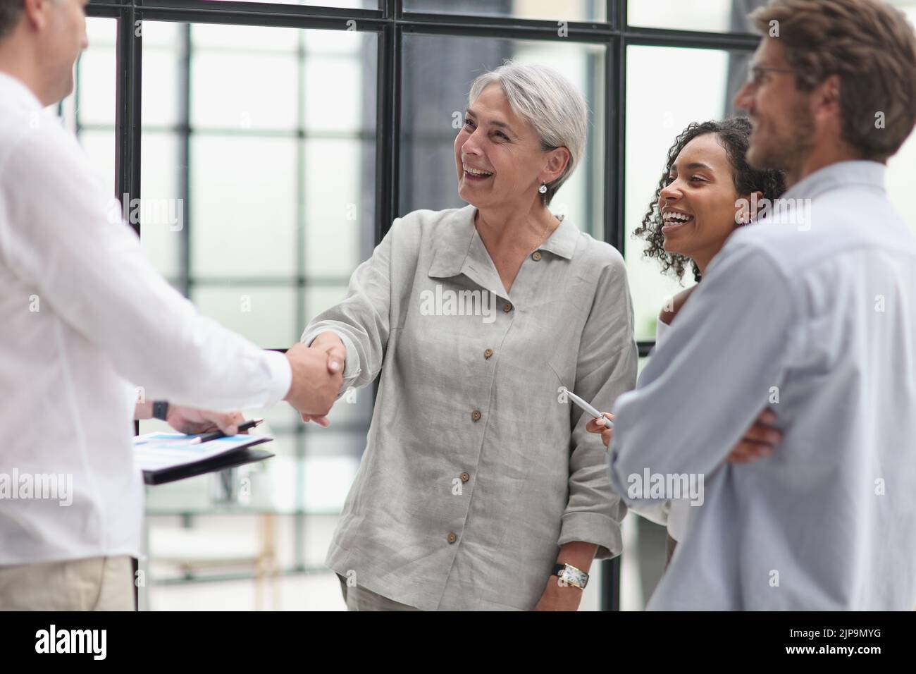 Conversation between managers and employees in the office Stock Photo ...