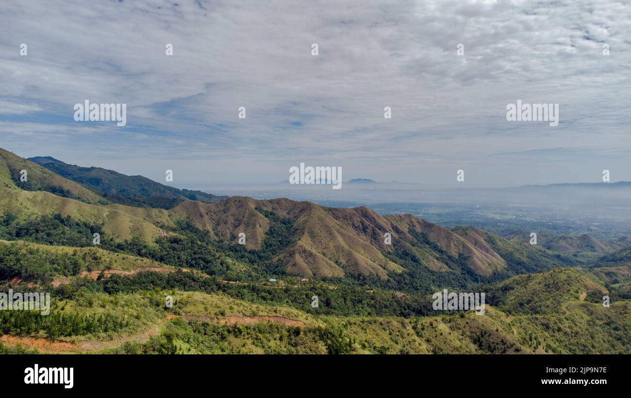 An aerial photo of a hill with green and shady trees, in the province ...