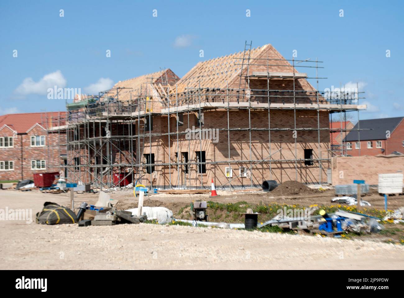 Partially constructed houses surrounded by scaffolding on a building ...