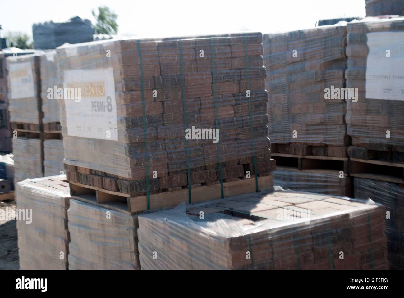 Stacked pallets of bricks on a building site Stock Photo - Alamy