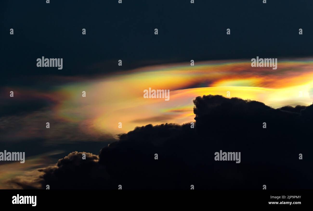 Cloud iridescence, or irisation, is a colorful light phenomenon that ...