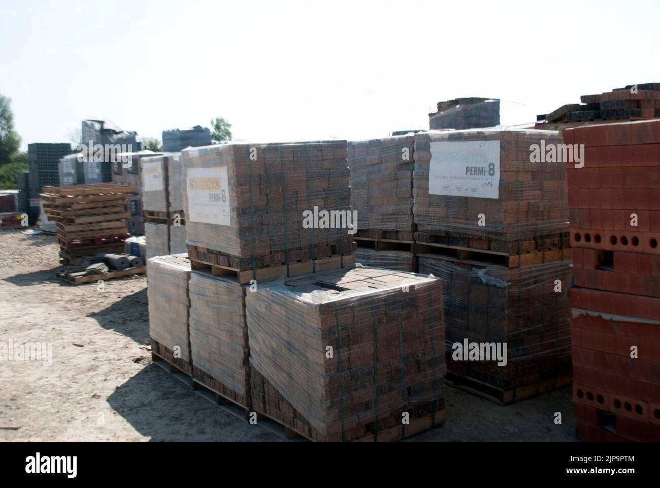 Stacked pallets of bricks on a building site Stock Photo - Alamy