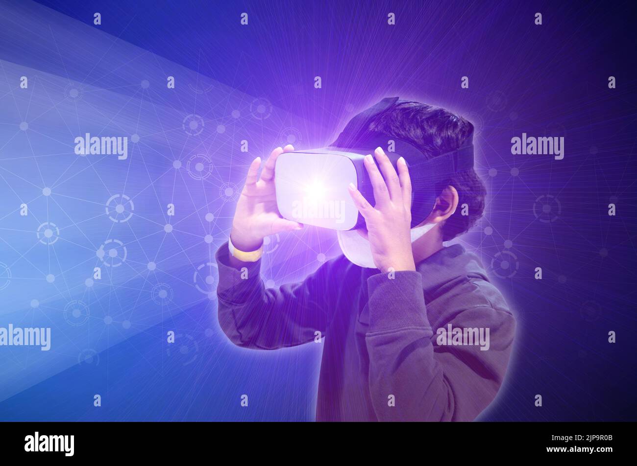 Asian kid boy using metaverse VR virtual reality glasses to digital ...