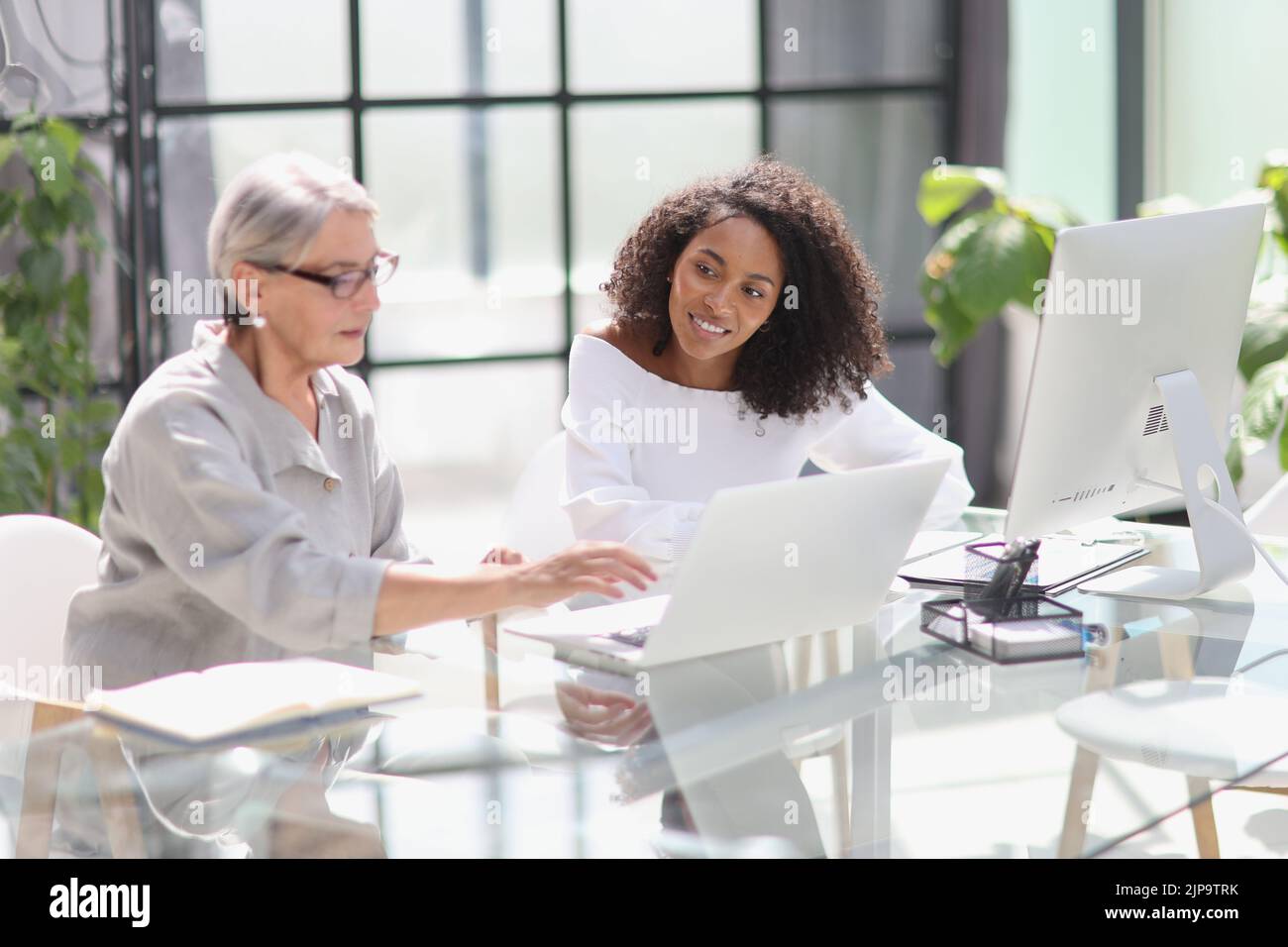 Software development team discussing algorithms on computer screen in office Stock Photo - Alamy