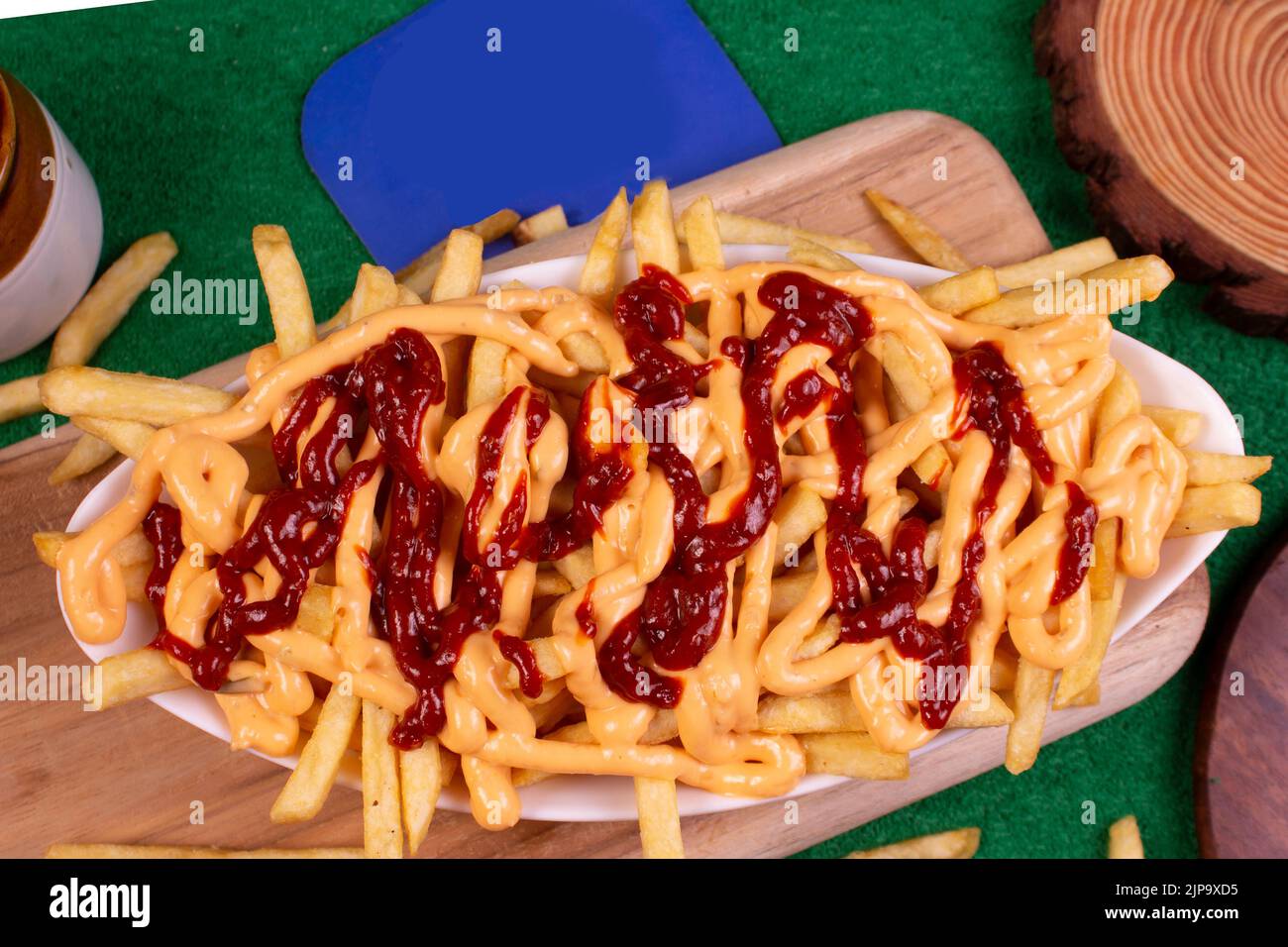 Dish of CHEESY FRIES at cafe restaurant. American fast food dish ...