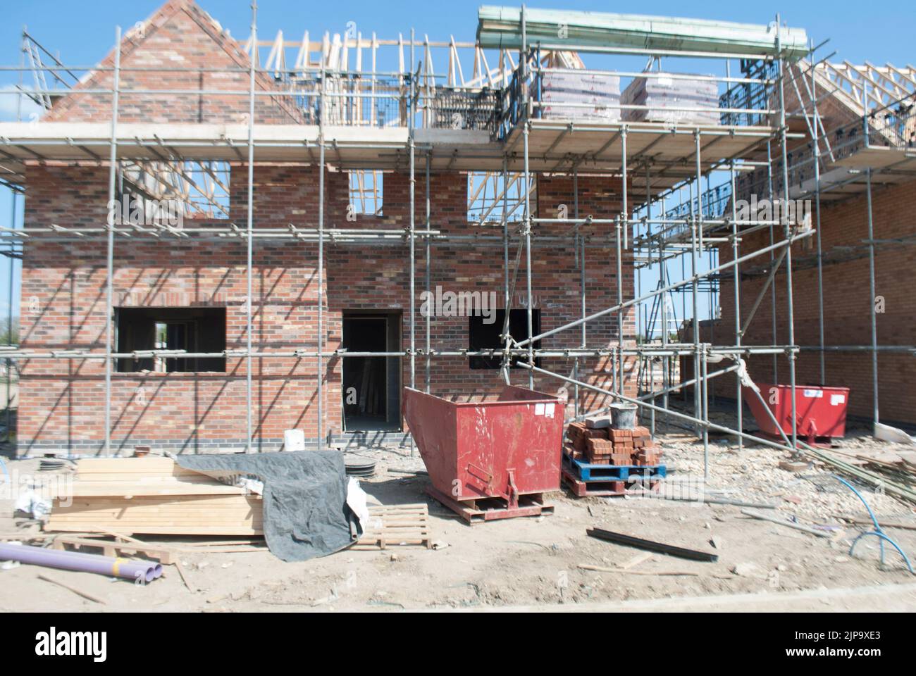 Partially constructed house surrounded by scaffolding on a building ...
