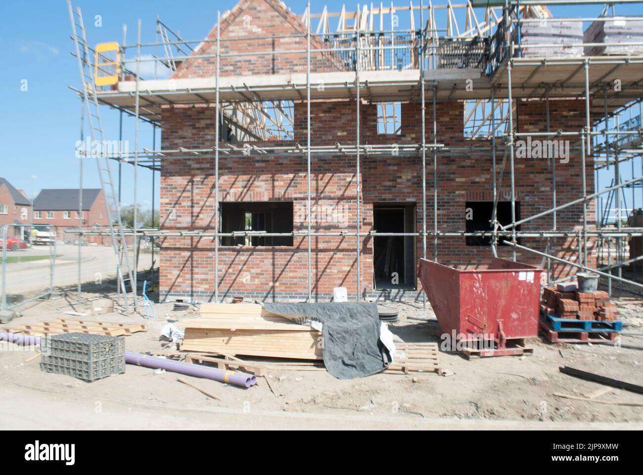 Partially constructed house surrounded by scaffolding on a building ...