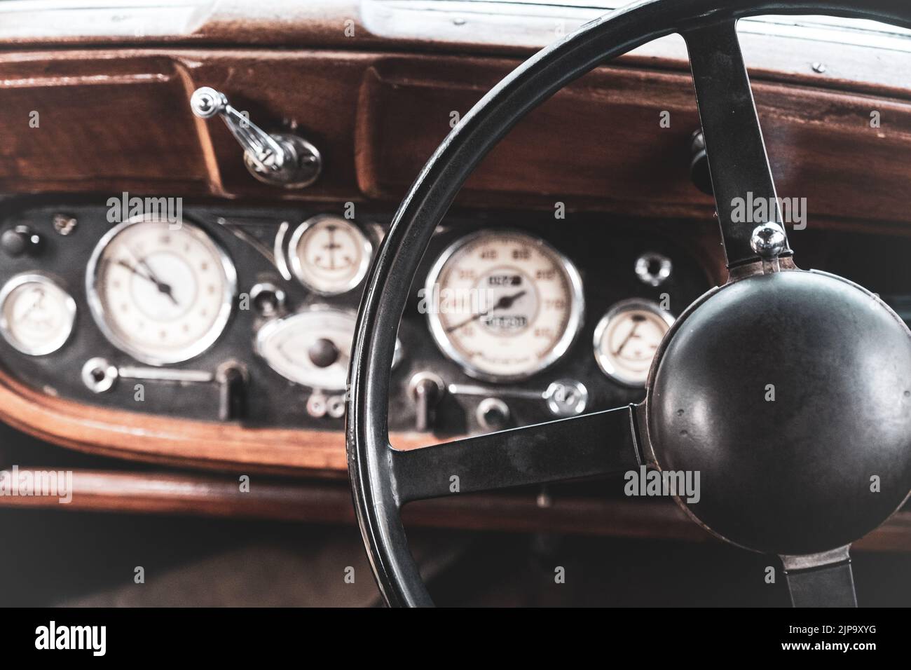 A steering wheel and instrument dials of a British vintage car Stock ...