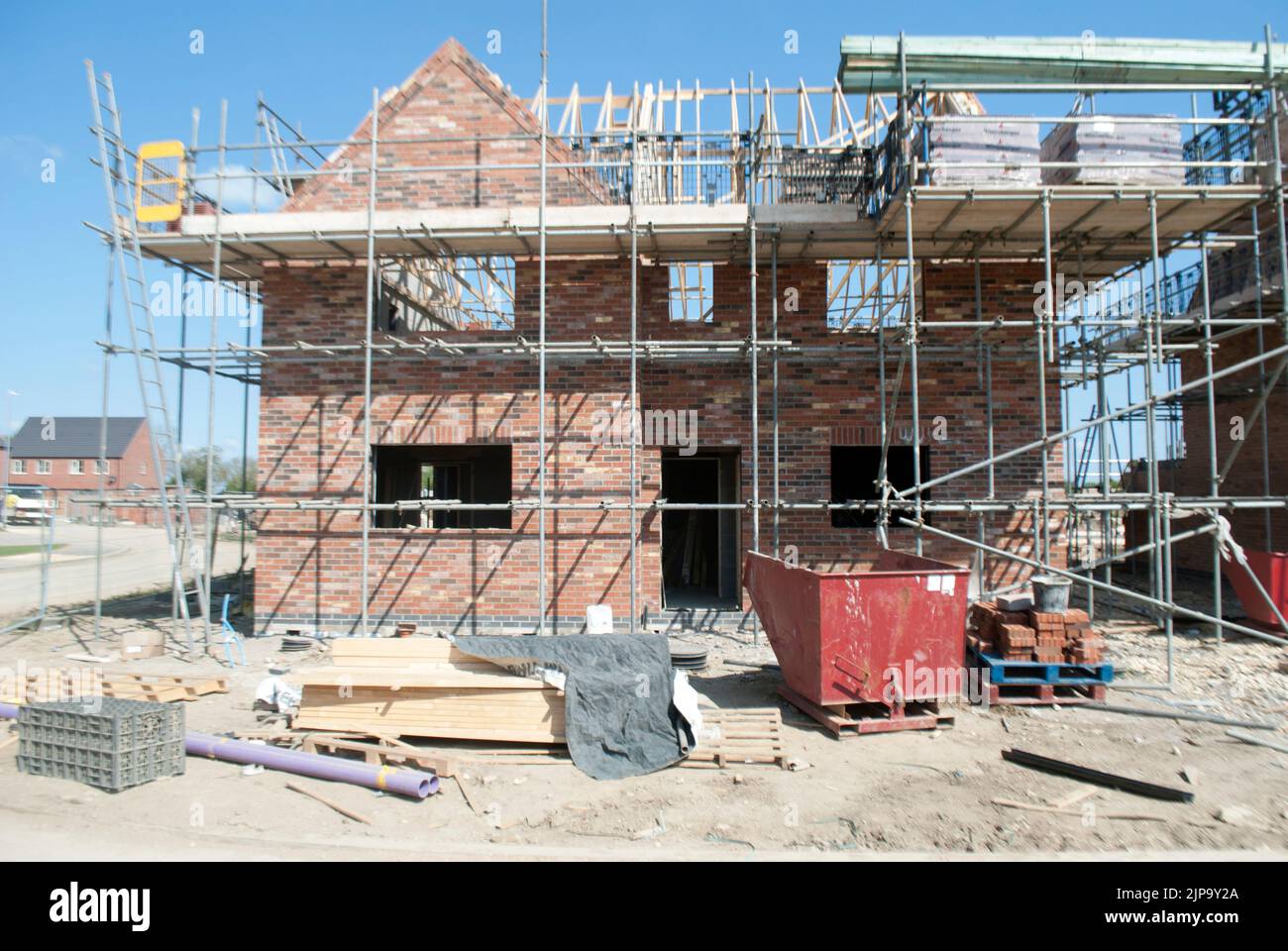 Partially constructed house surrounded by scaffolding on a building ...