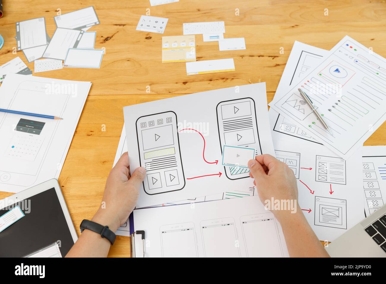 Graphic designers work together with UX UI designer planning ...