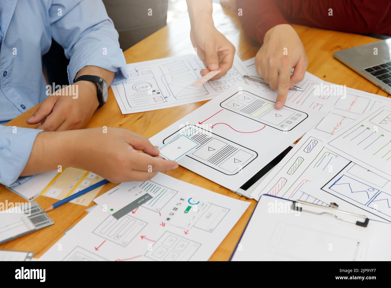 Graphic designers work together with UX UI designer planning ...