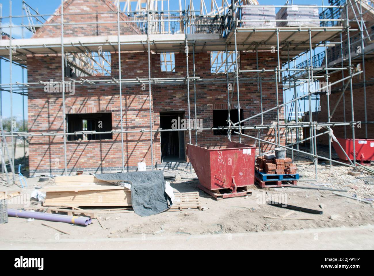 Partially constructed house surrounded by scaffolding on a building ...