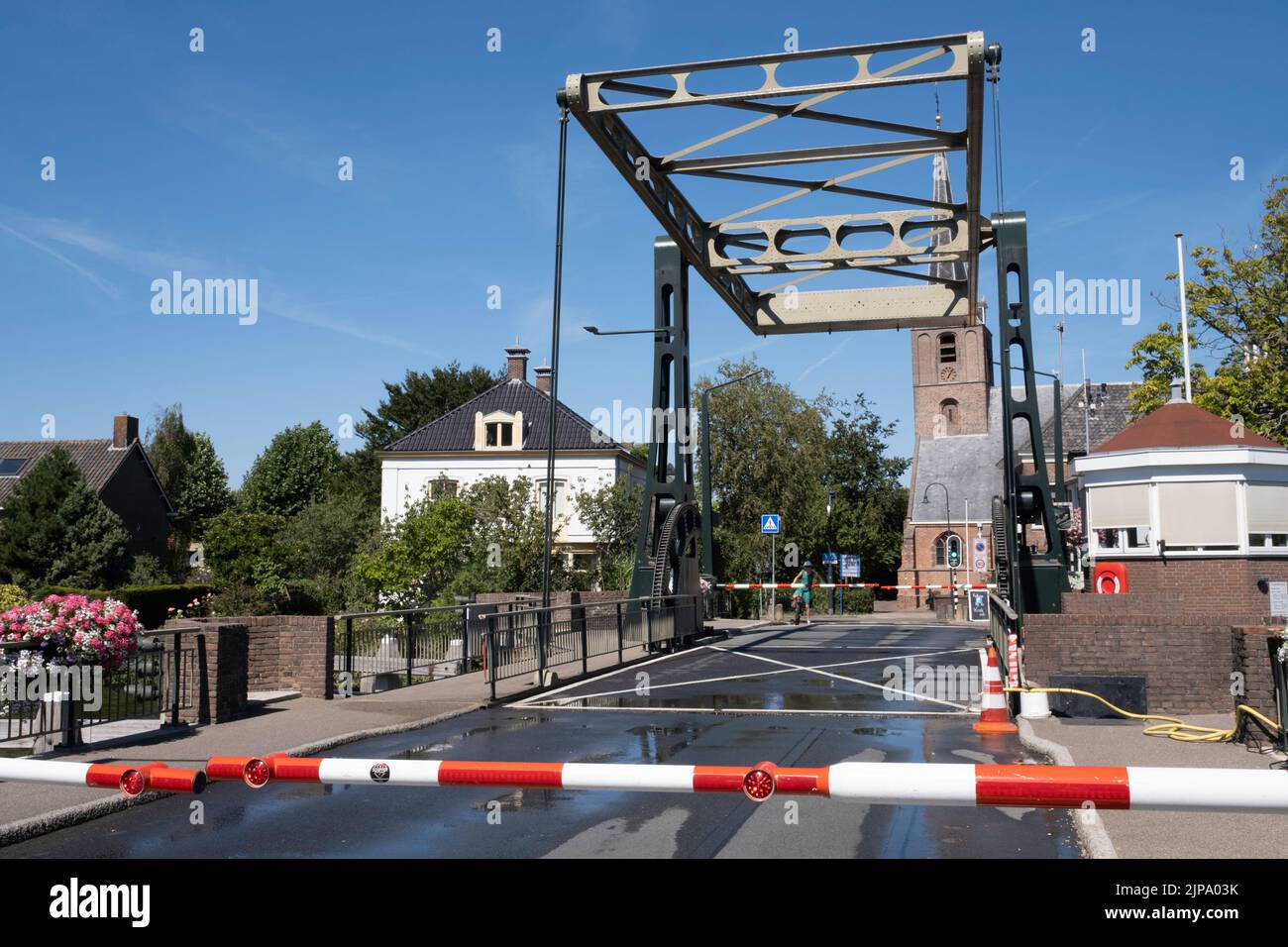 Drawbridge in Koudekerk, the barriers are down. The road surface is ...