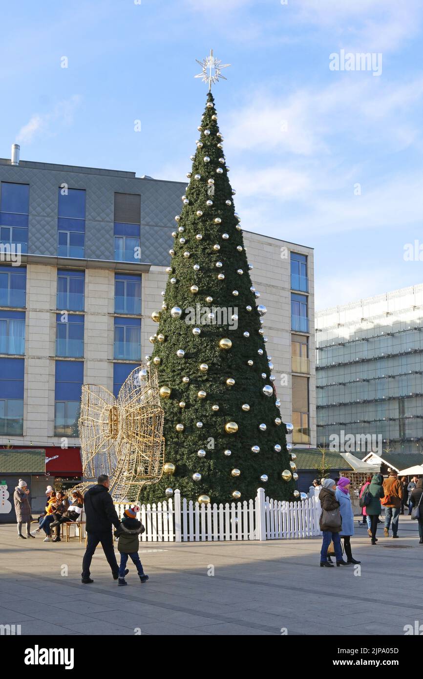 Traditional big christmas tree in front of modern building Stock Photo ...
