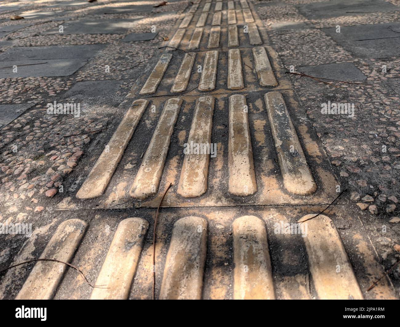A closeup of an old dirty guiding block for blind people Stock Photo ...