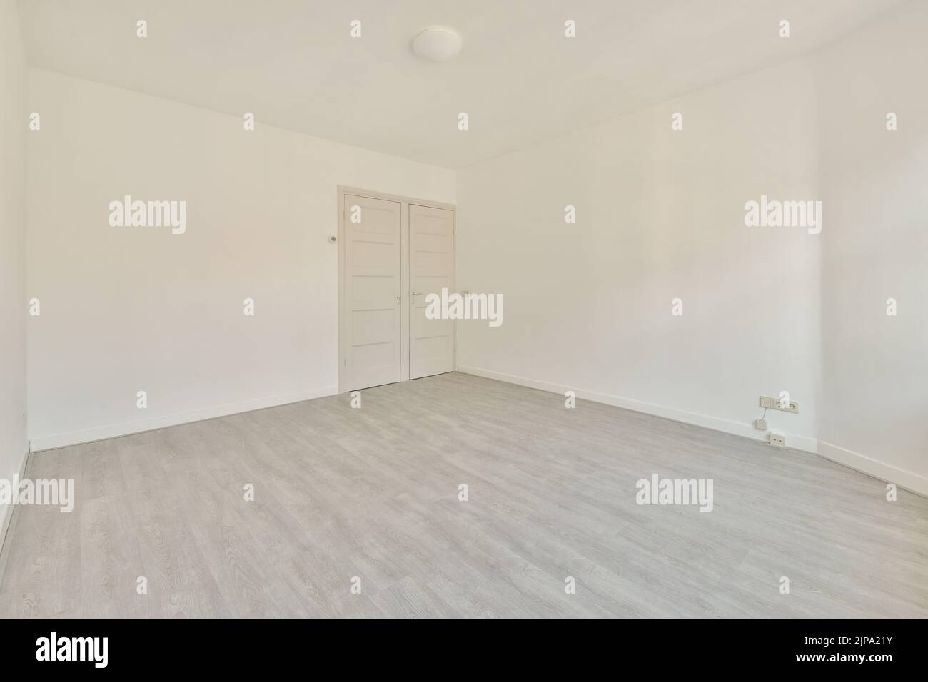 Interior of empty white room with large balcony windows with curtains ...