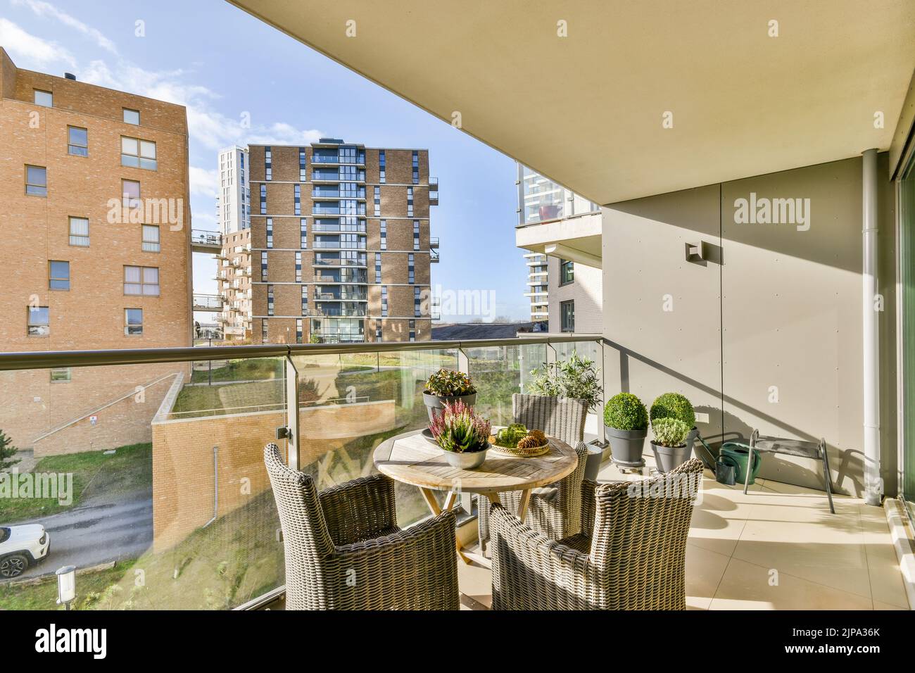 Sitting area in balcony with comfortable furniture around beautiful ...