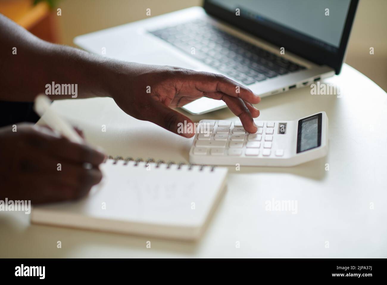 Hands of man planning budget, calculating expenses and taking notes in ...