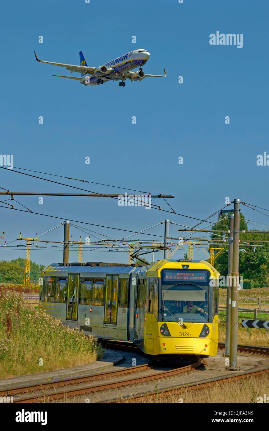 Manchester Metrolink tram approaching the Manchester Airport station ...