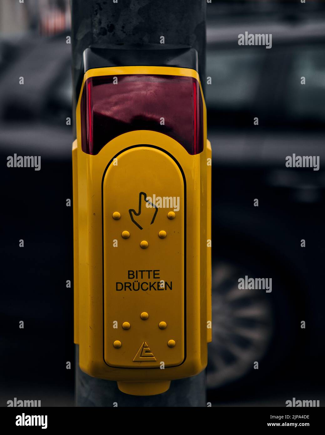 A yellow traffic light call button Stock Photo - Alamy
