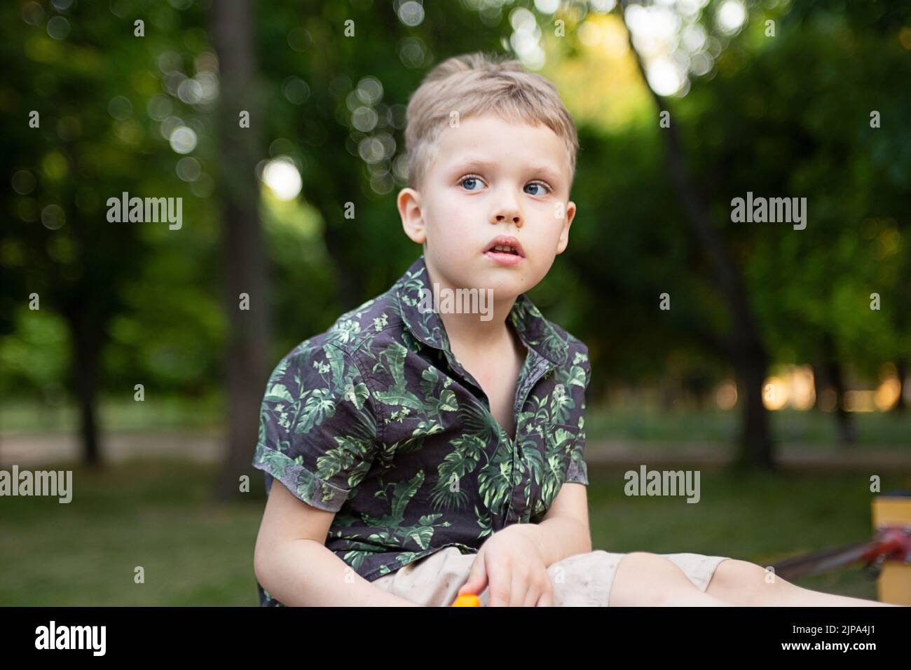 Sad boy on playground.Concept of emotions Stock Photo - Alamy